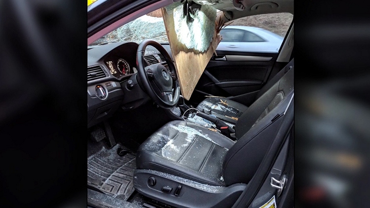 Driver charged after plywood flies through the windshield of another ...